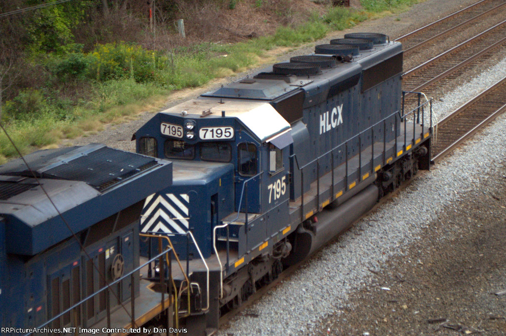 HLCX SD40-2 7195 trails on Q409-12